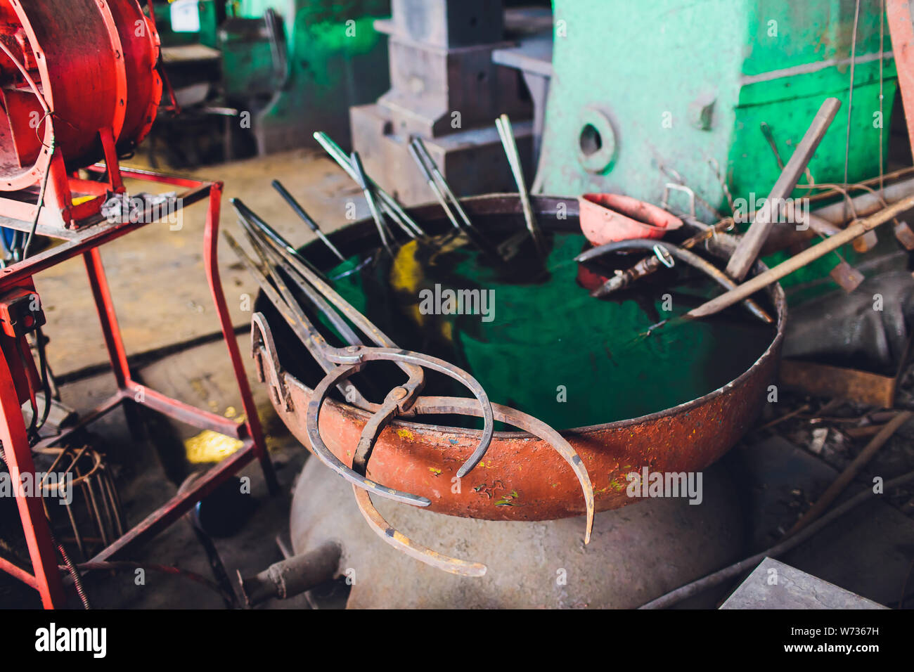 The process of forging metal in the production of heavy molded metal ...