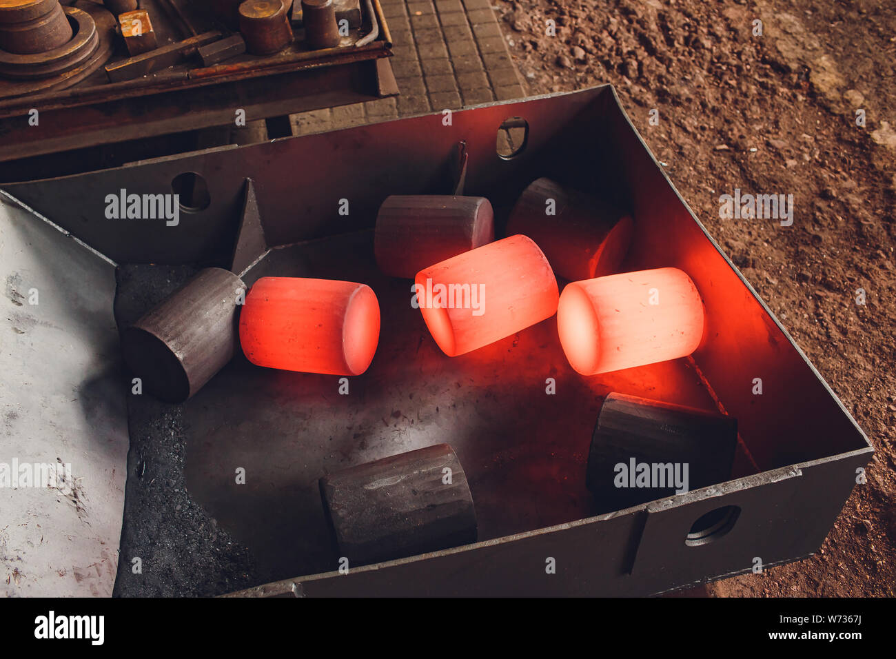 The process of forging metal in the production of heavy molded metal ...
