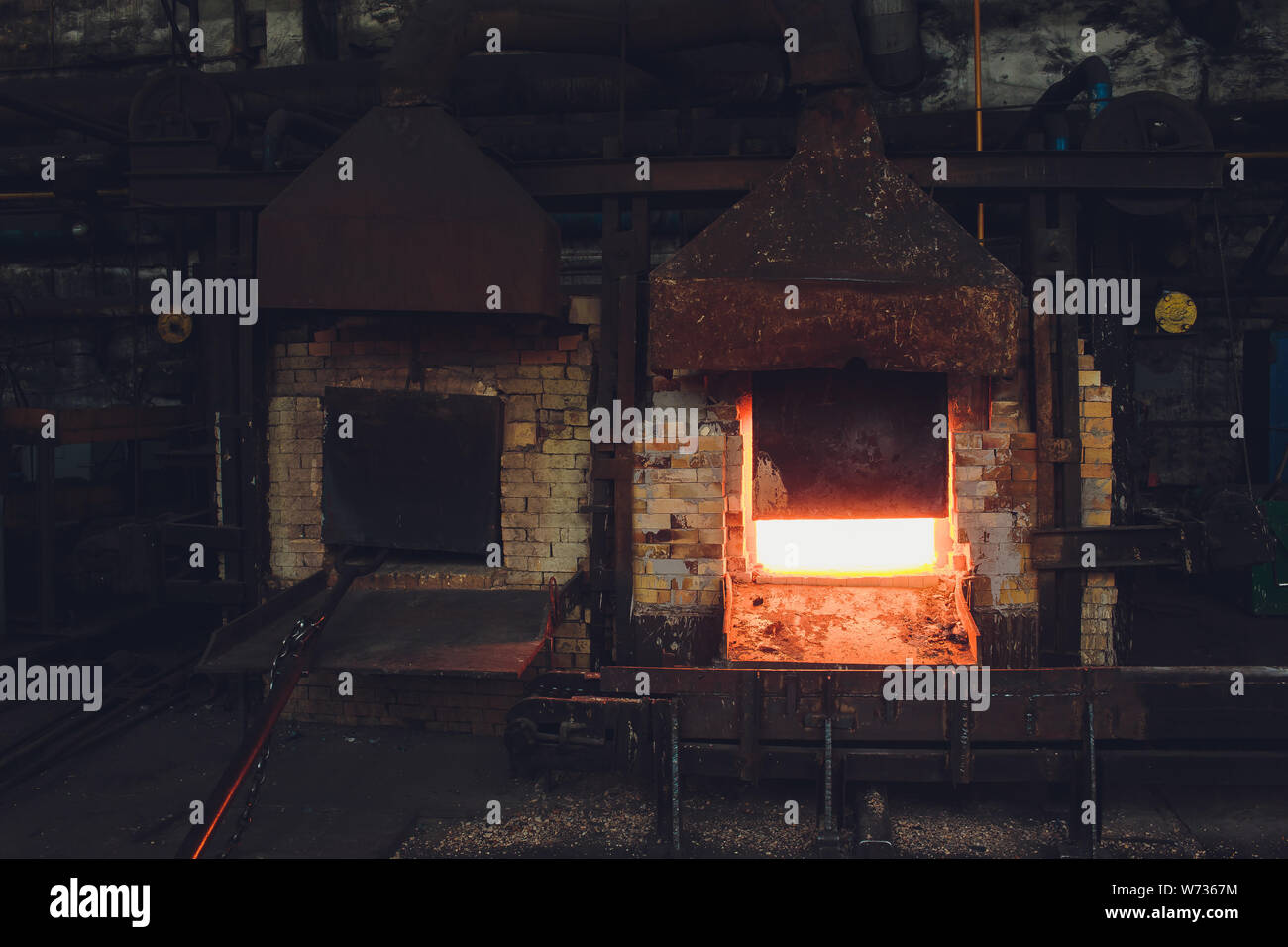 The process of forging metal in the production of heavy molded metal ...