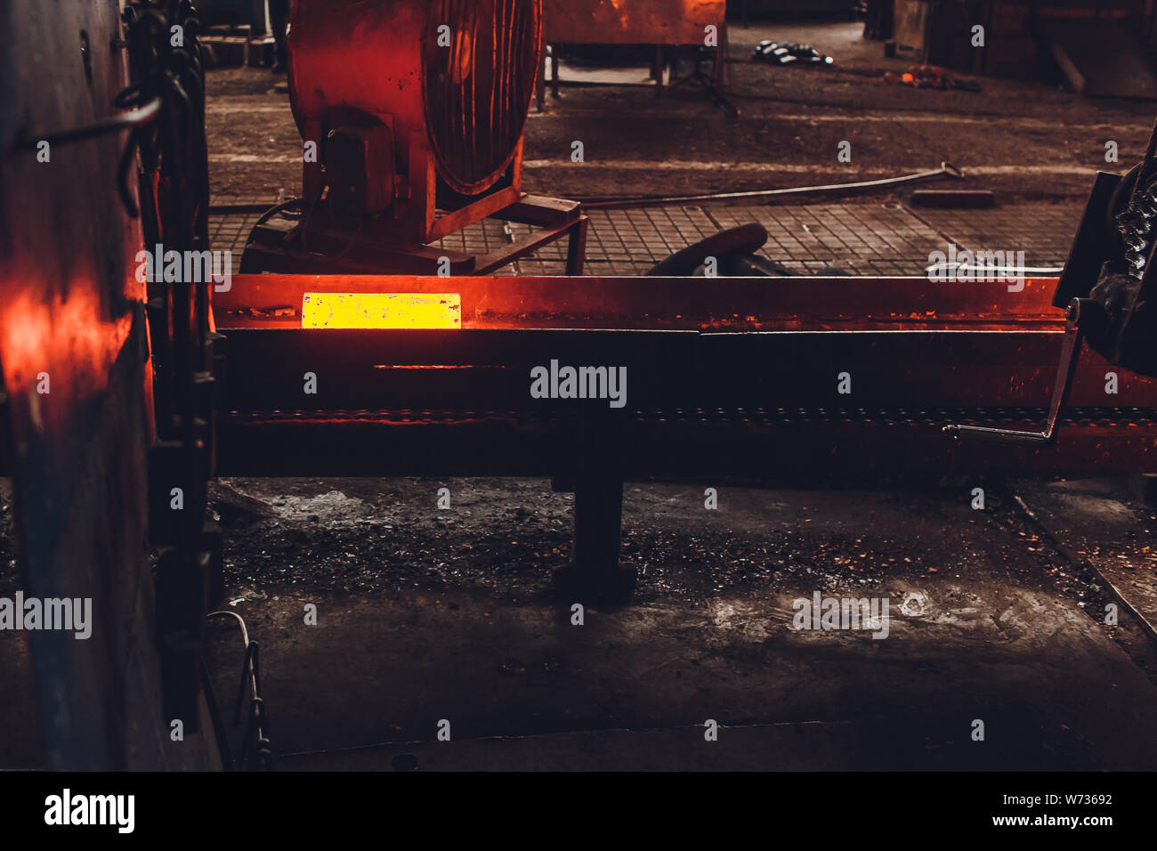 The process of forging metal in the production of heavy molded metal ...