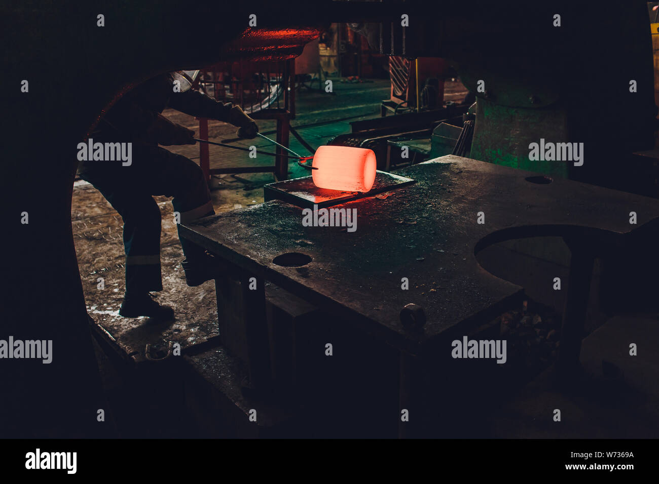 The process of forging metal in the production of heavy molded metal ...