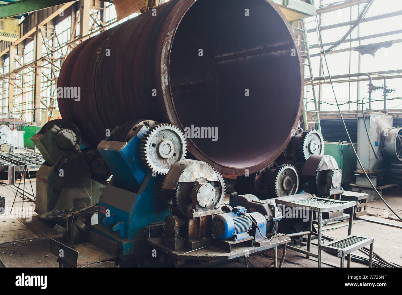 Huge metal tunnel made of rounded steel pipes in the factory hall Stock ...