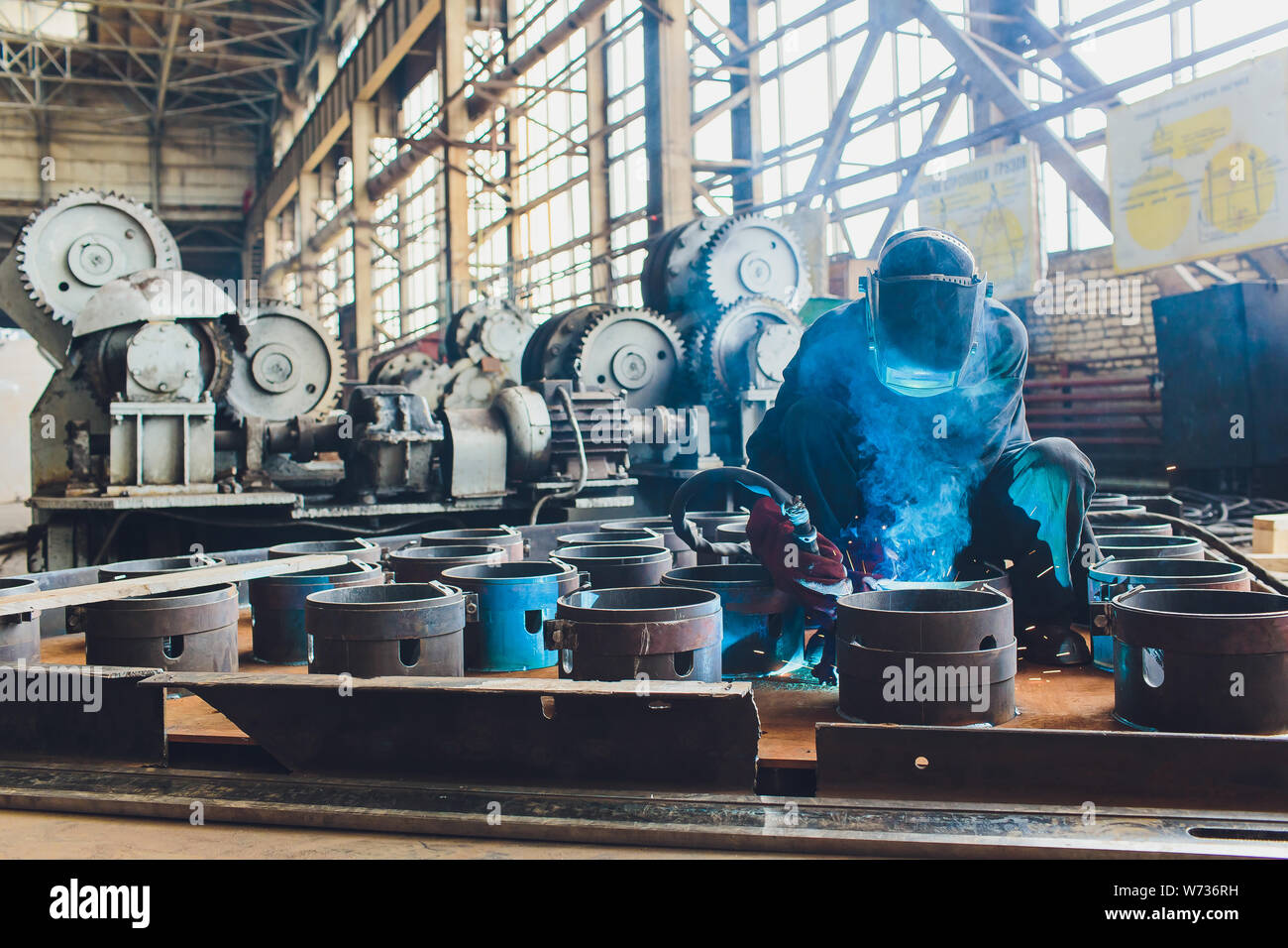 man factory interior, worker and cnc machine Stock Photo - Alamy