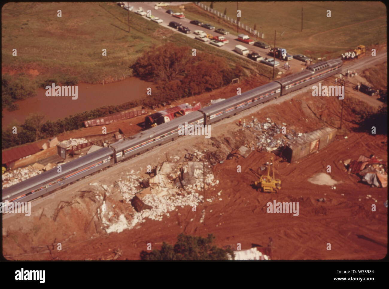 THE LONE STAR PASSENGER TRAIN SLOWLY MAKES ITS WAY PAST DEBRIS WHICH ...