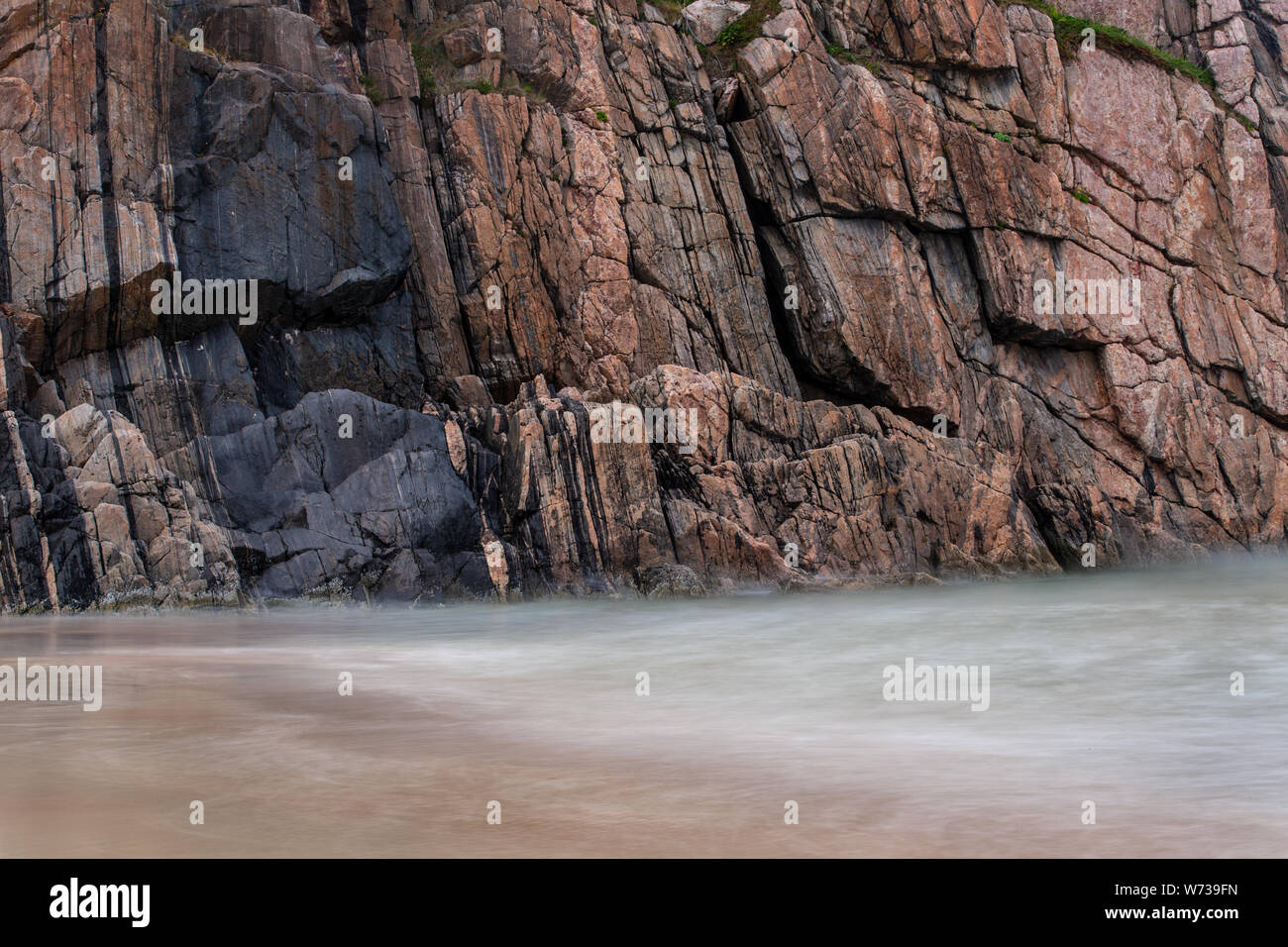 red stones and flowing water Stock Photo - Alamy