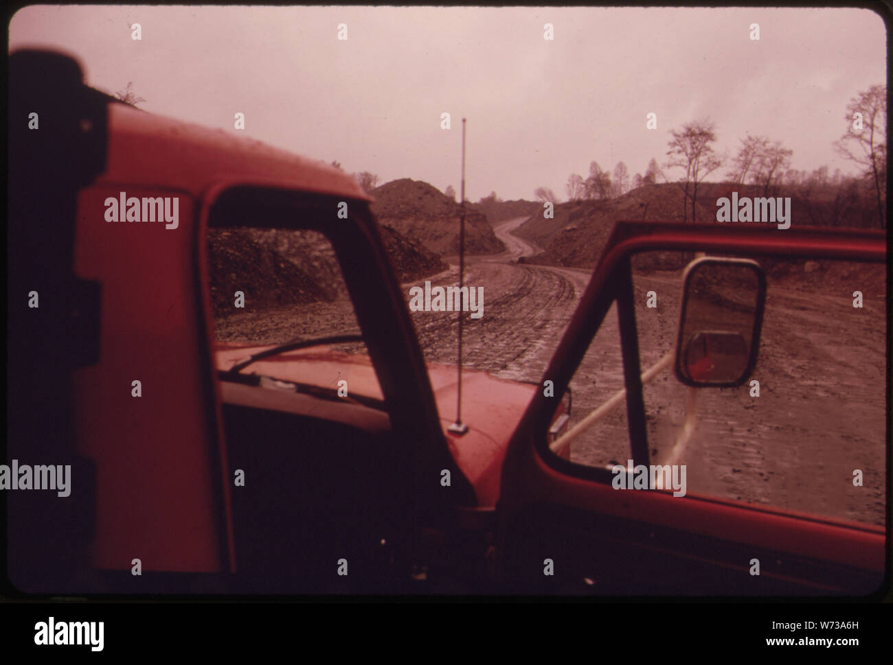 THIS HAULING ROAD IS A BLEAK STRETCH WITH MILE AFTER MILE OF BARREN AND ...