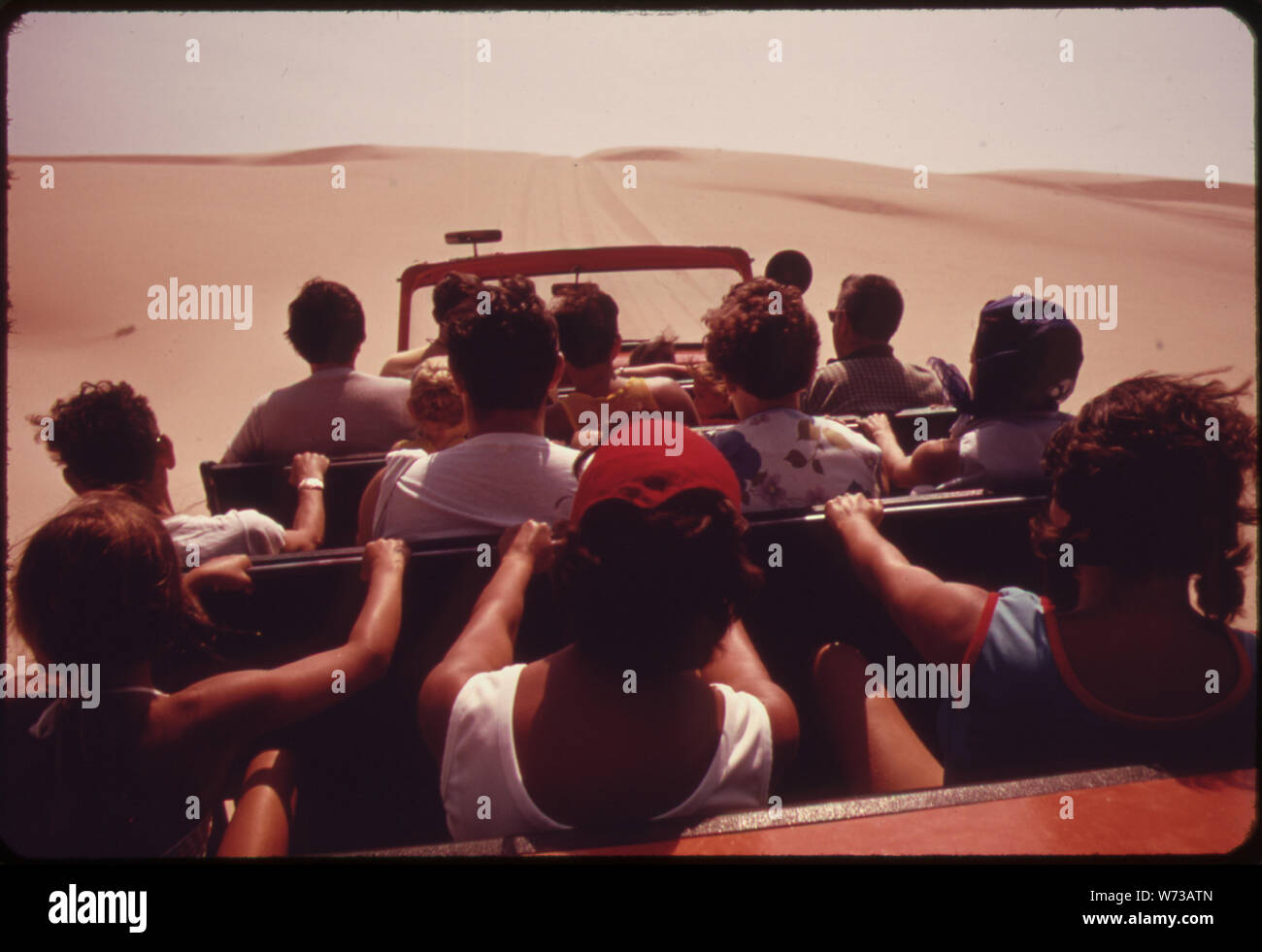 TOURISTS IN DUNE BUGGY RIDE OVER SHIFTING SAND DUNES AT SILVER LAKE ...