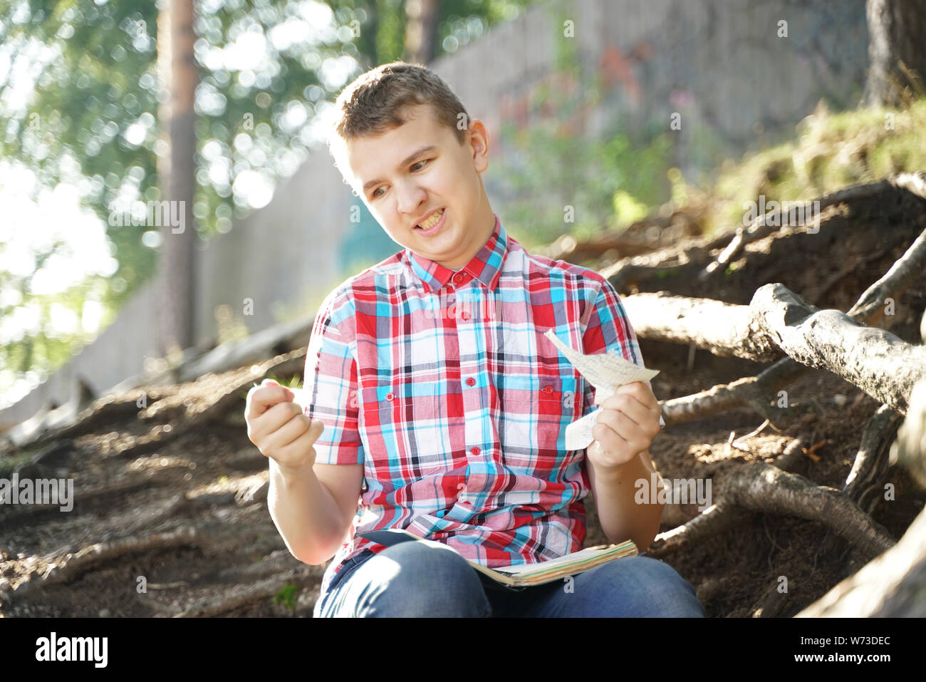 the student gets angry and tears up his notebook with the homework ...