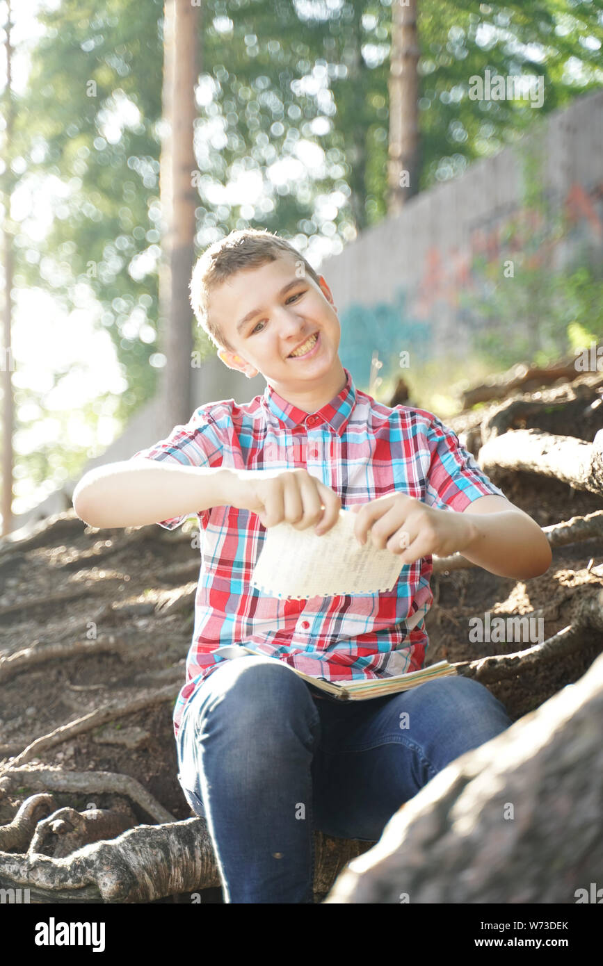the student gets angry and tears up his notebook with the homework ...