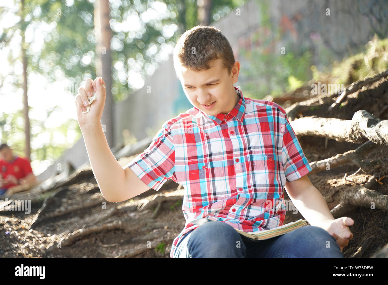the student gets angry and tears up his notebook with the homework ...