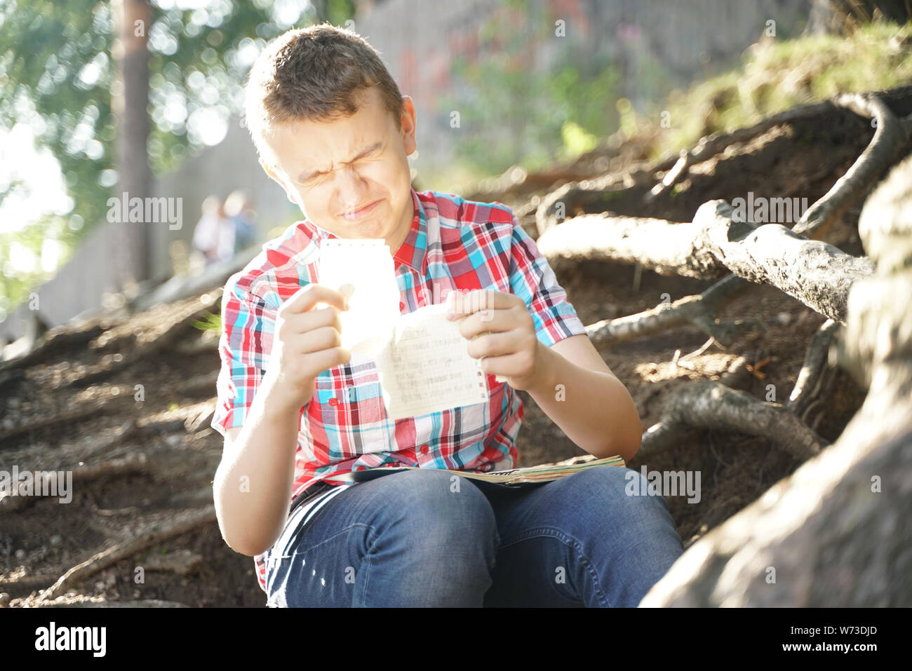 the student gets angry and tears up his notebook with the homework ...