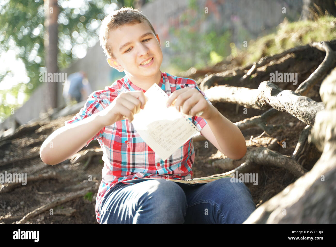 the student gets angry and tears up his notebook with the homework ...