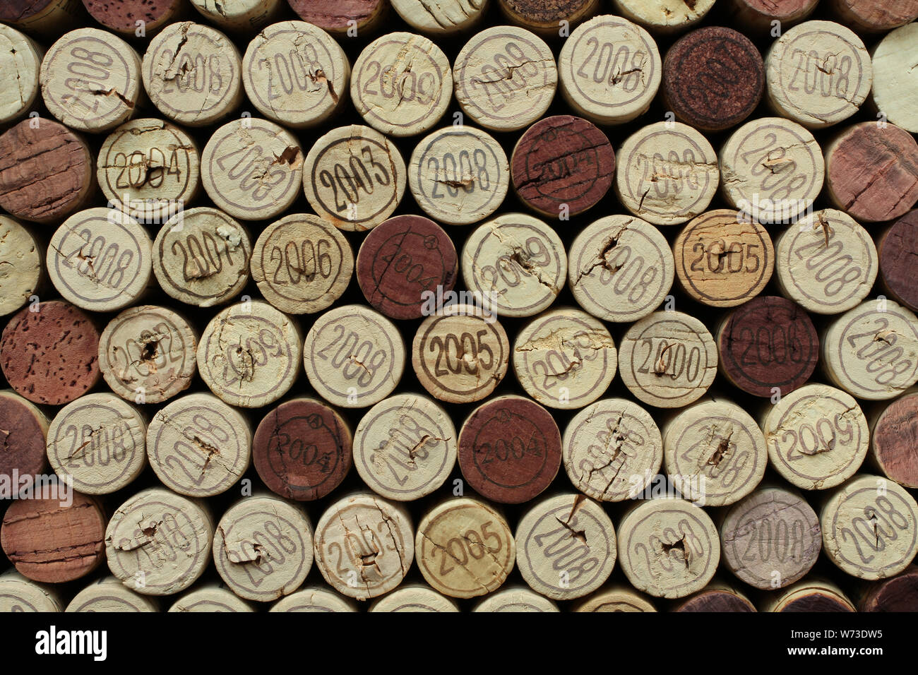 Cork wine bottle tops with numbers of years arranged close to each ...