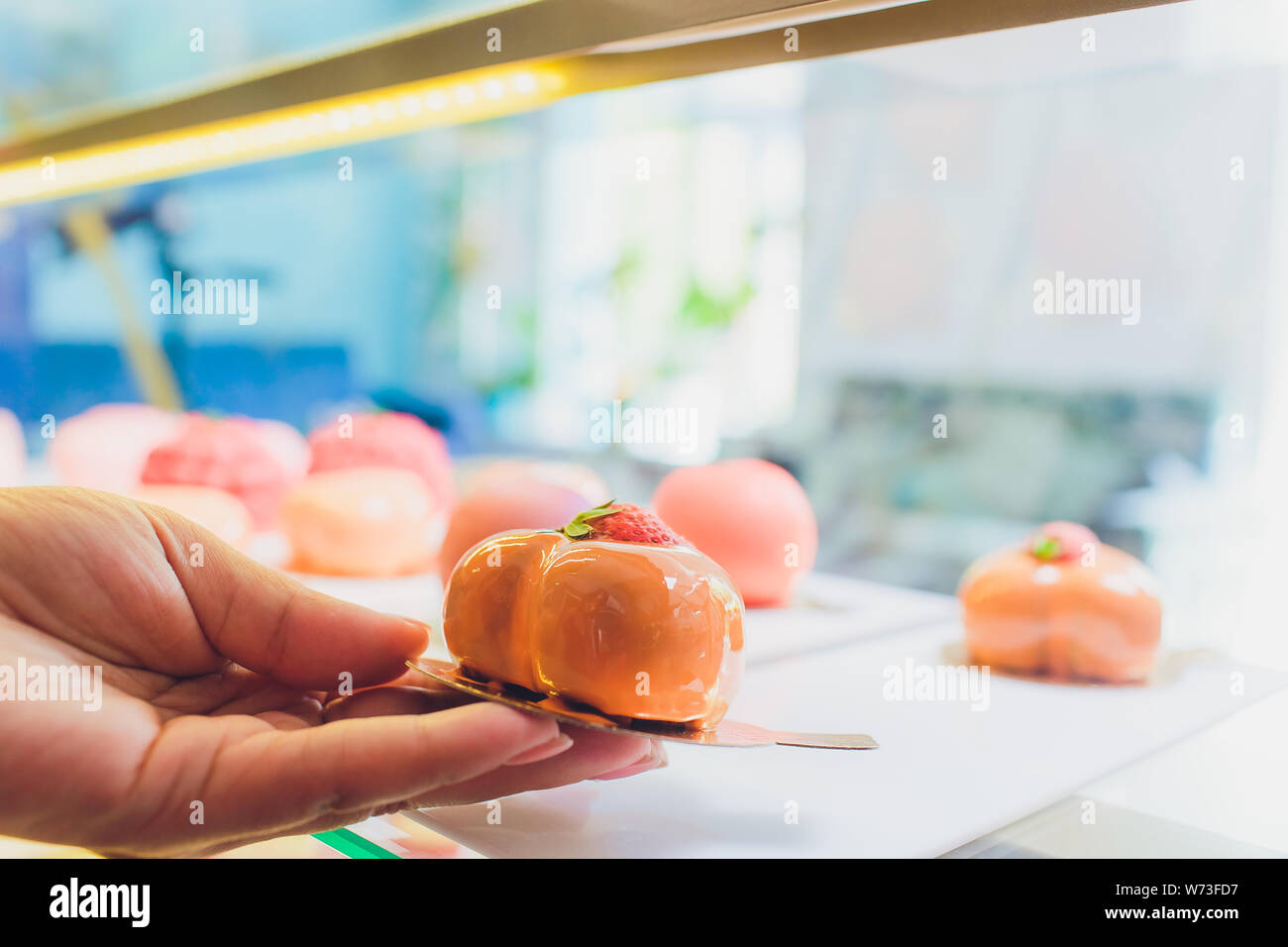 Woman taking piece cake from hi-res stock photography and images - Alamy