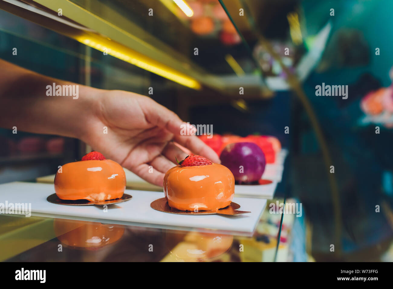Woman taking piece cake from hi-res stock photography and images - Alamy