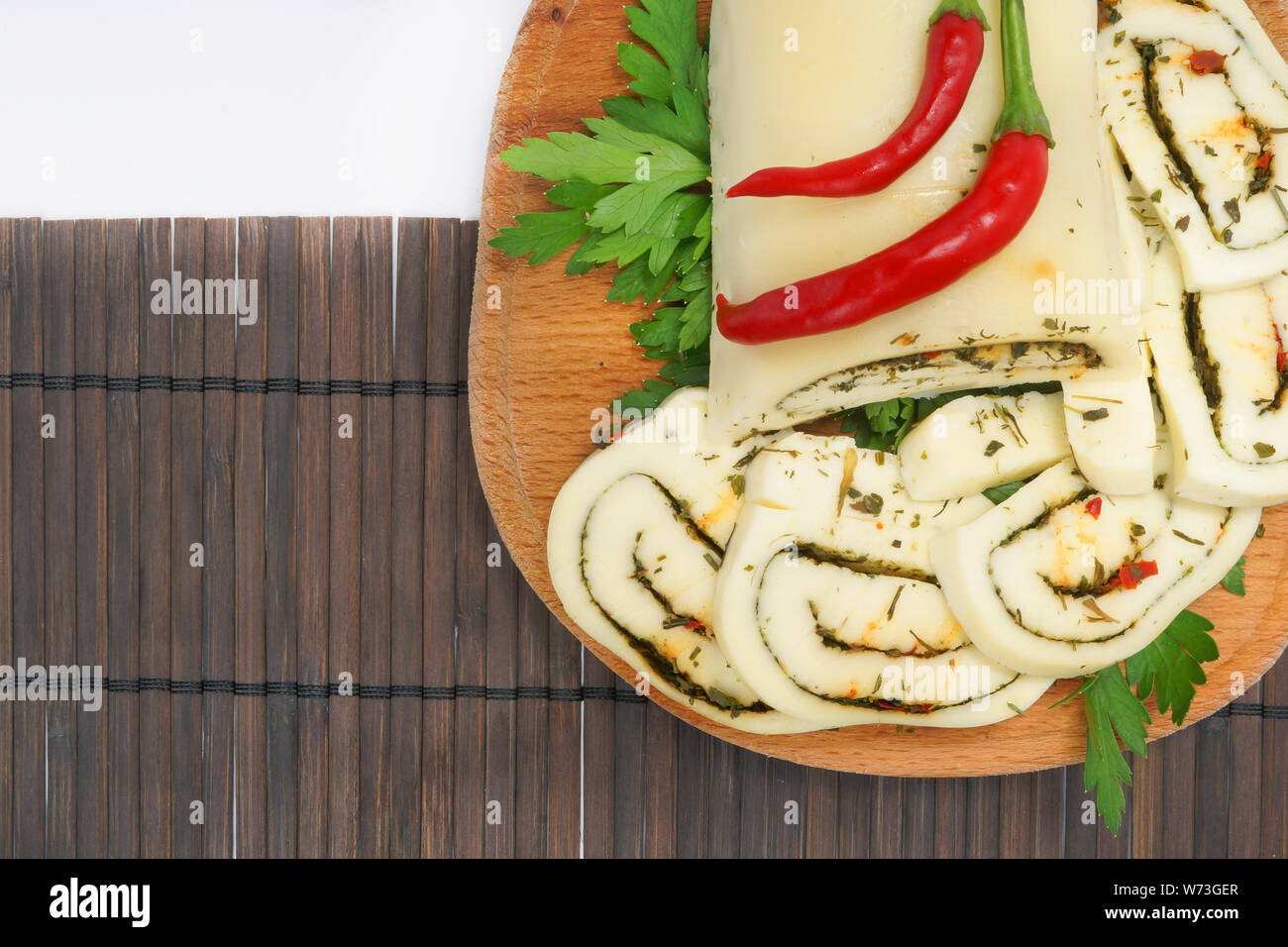 Cheese with spices. Red pepper Stock Photo - Alamy