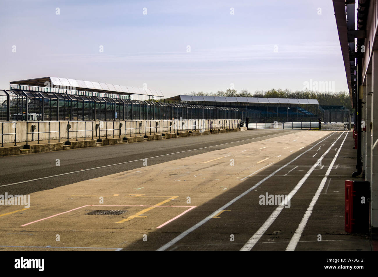The exit of the deserted original pit lane at Silverstone race track ...