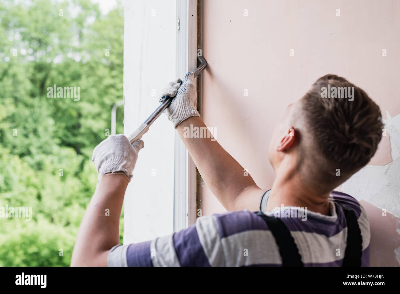 Process male worker repairing window in house, close up Stock Photo - Alamy