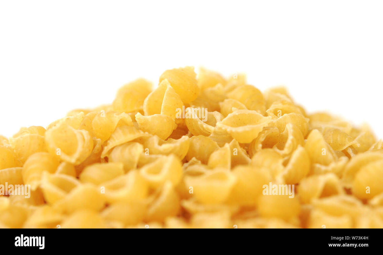 shell shape pasta on white background Stock Photo - Alamy