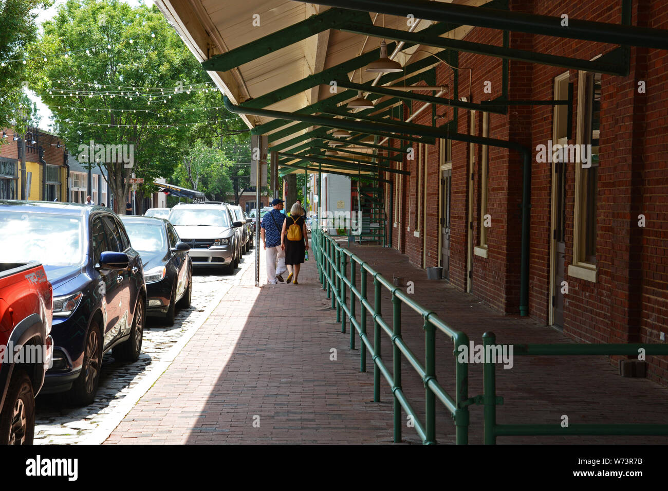 An overhang shades the sidewalk at the historic City Market in downtown ...