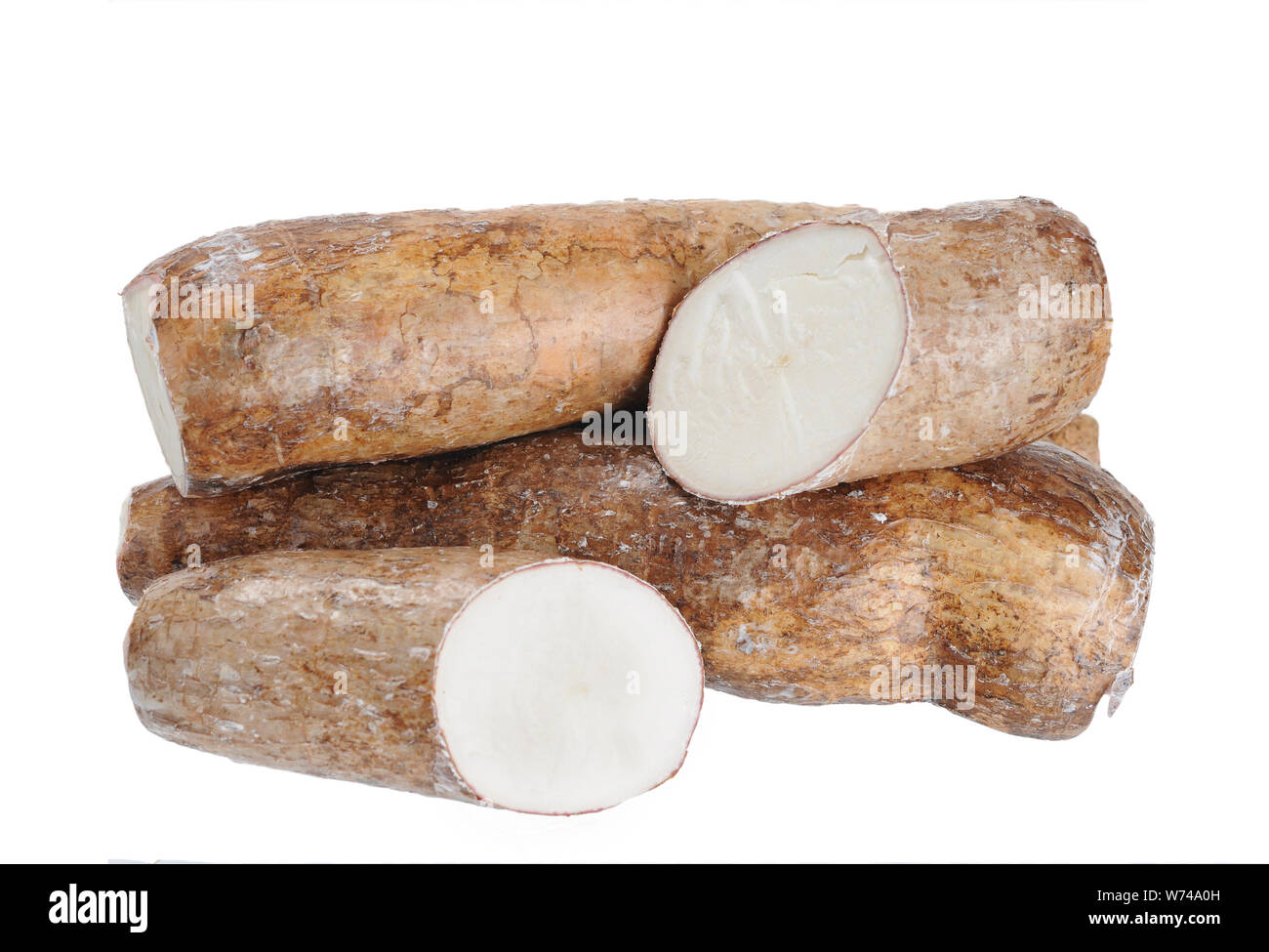 chopped and whole cassava isolated on white background Stock Photo - Alamy