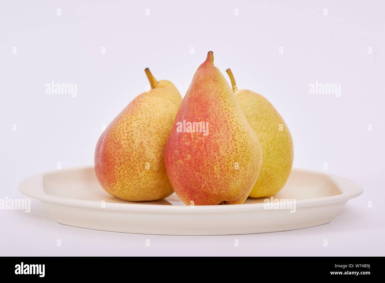 Three pears on a white hi-res stock photography and images - Alamy