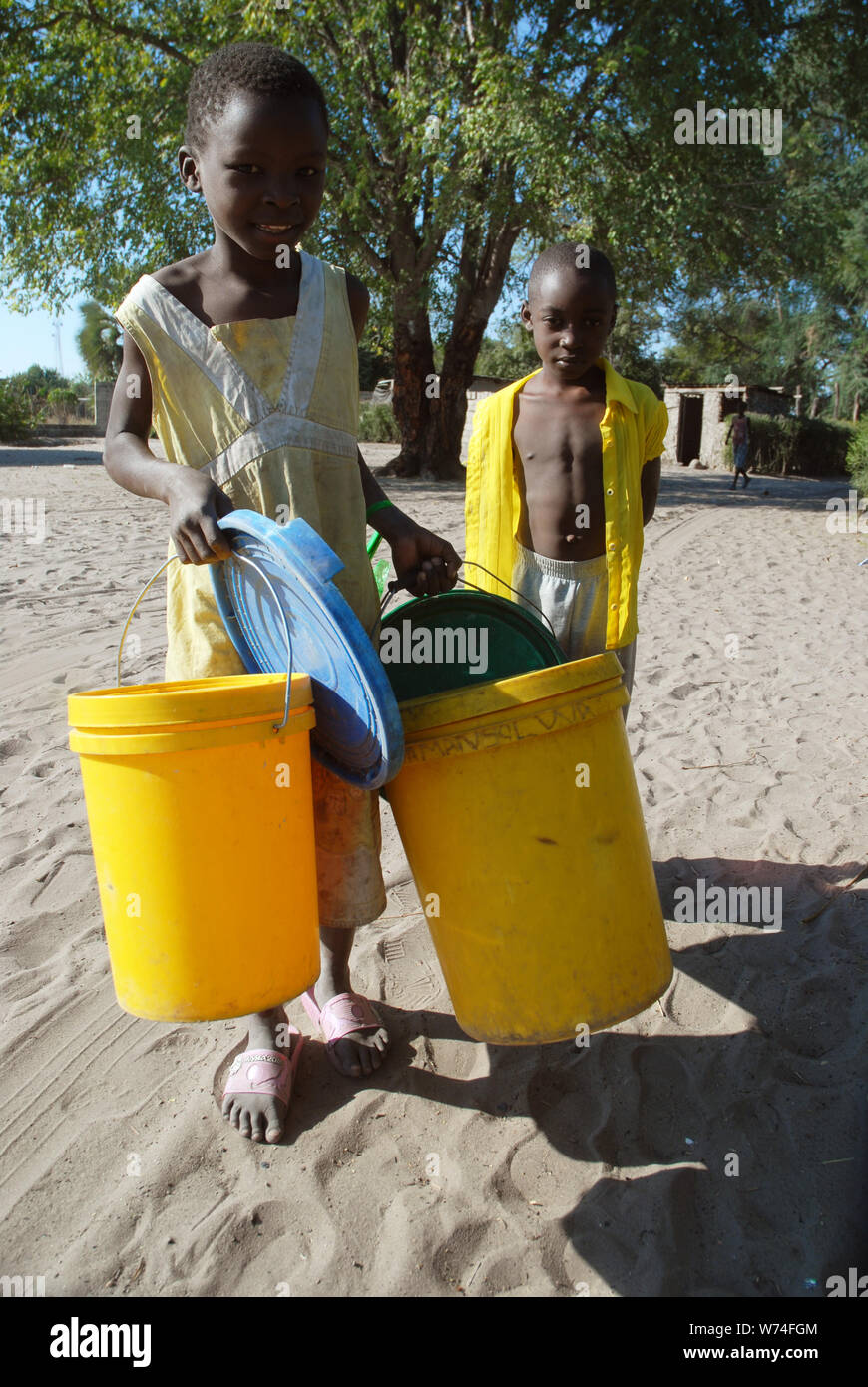 Young village children collecting water, Mwandi, Zambia. Africa Stock ...
