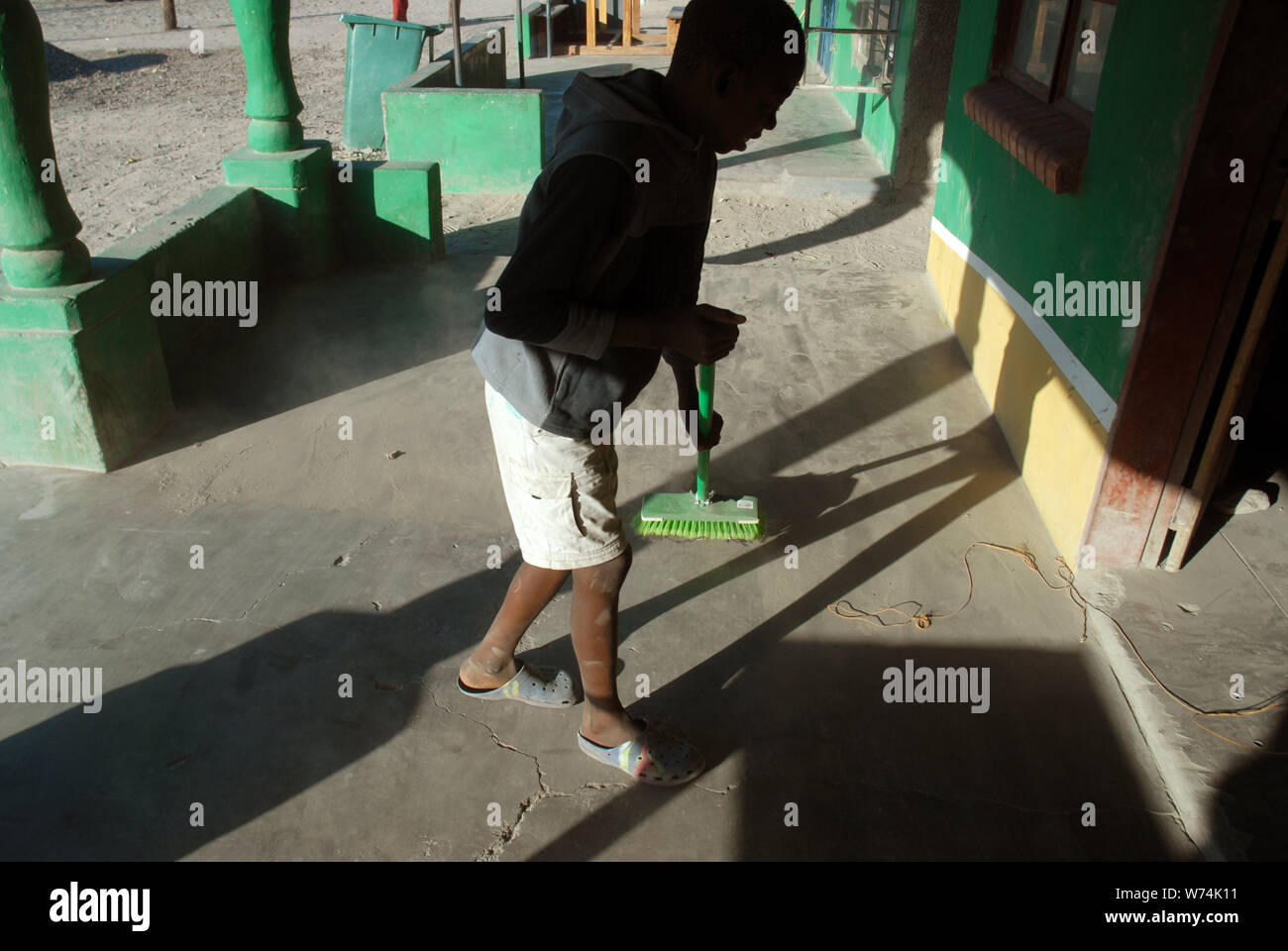 Sweeping floor africa hi-res stock photography and images - Alamy