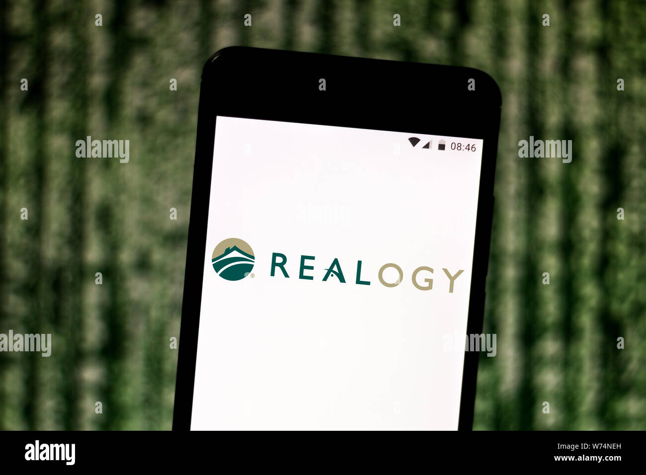 In this photo illustration the Realogy Holdings logo is seen displayed ...
