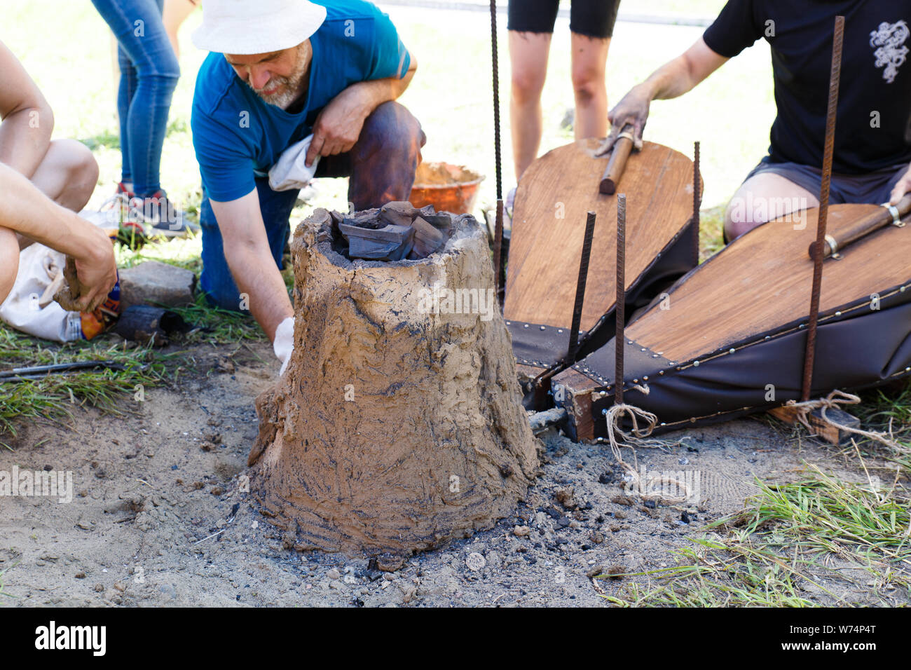 Novokuznetsk. Russia. 07.07.2019. Heating of the medieval clay furnace ...