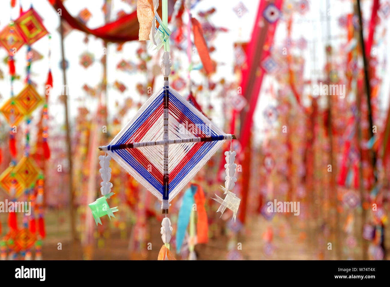 photo of colorful tung flag as background Stock Photo - Alamy