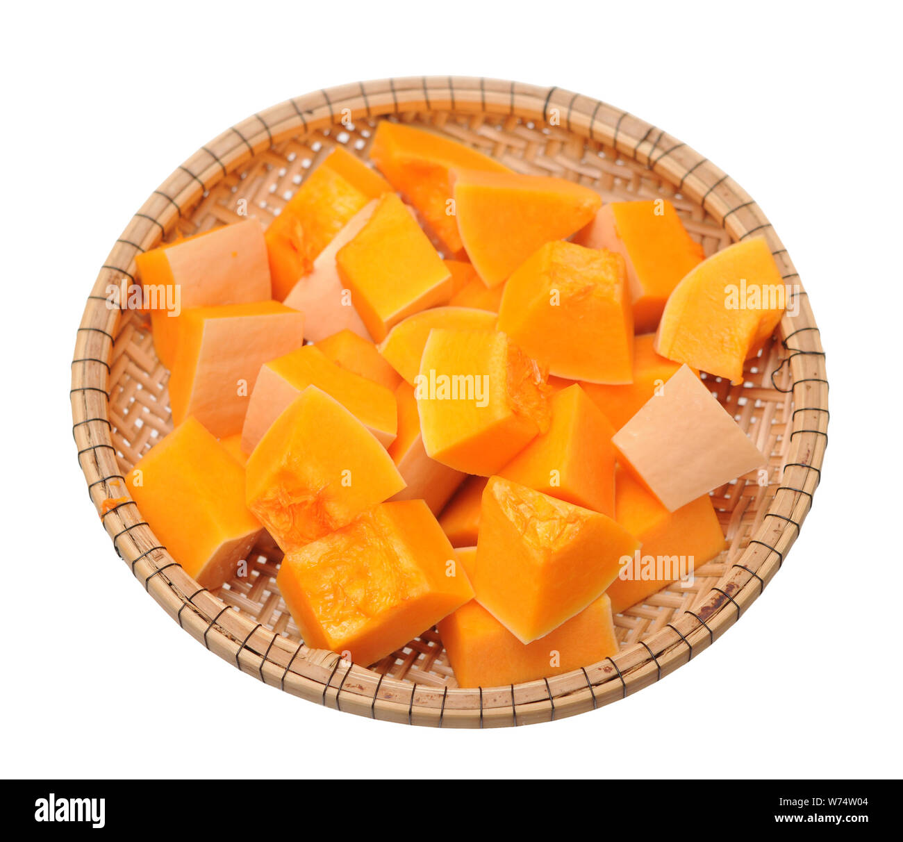 chopped pumpkin on bamboo basket isolated on white background Stock ...