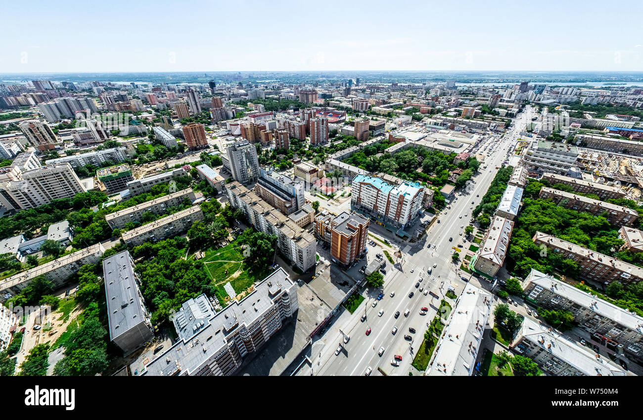 Aerial city view with crossroads and roads, houses, buildings, parks ...
