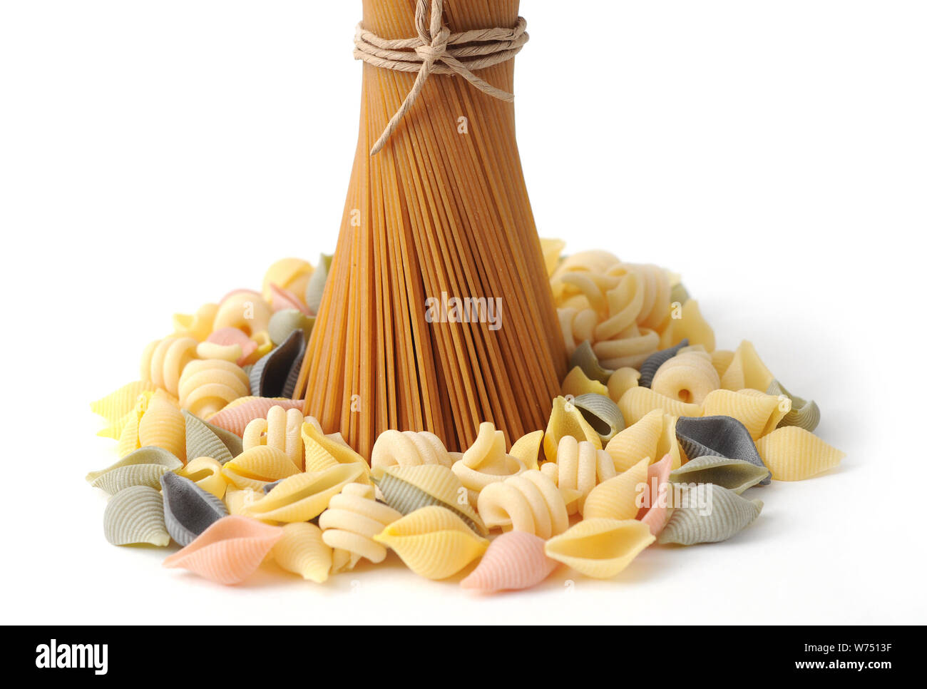 sconcigli seashell pasta shape, Spaghetti and Conchiglie pasta on white ...