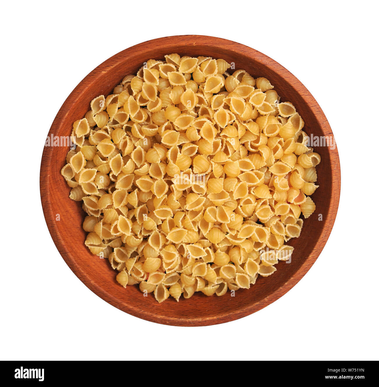 shell shape pasta in wooden bowl isolated on white background Stock ...