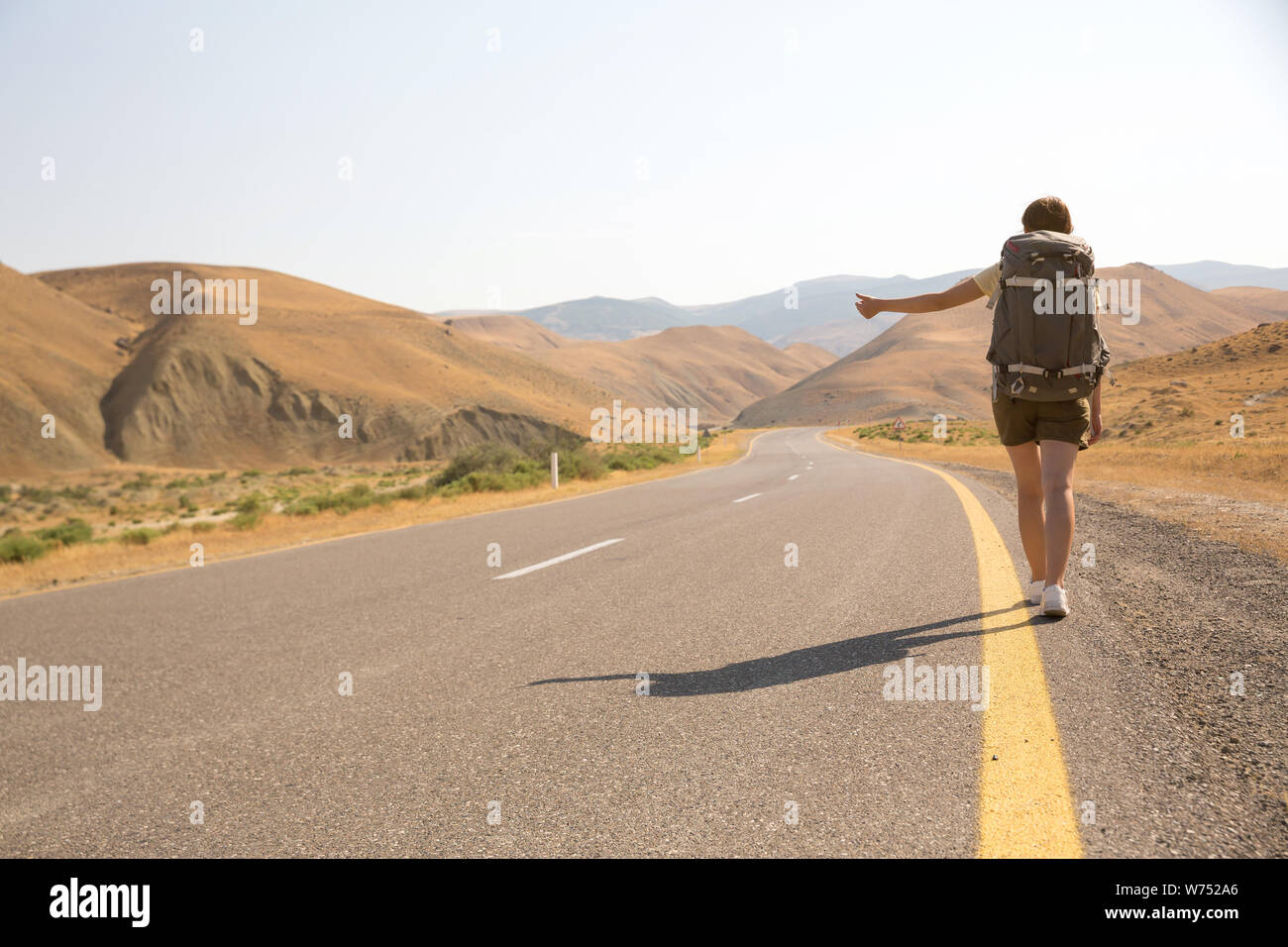 Hitchhiker Traveler Woman On The Road In Sunset Girl Traveler Hiker On The Road Summer