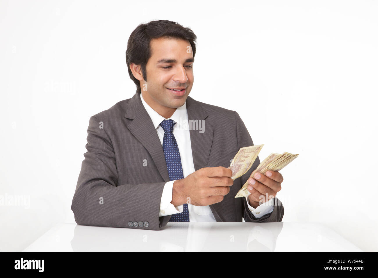 Asian man counting cash hi-res stock photography and images - Alamy
