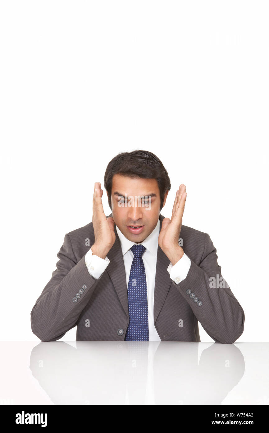 Businessman looking shocked Stock Photo - Alamy