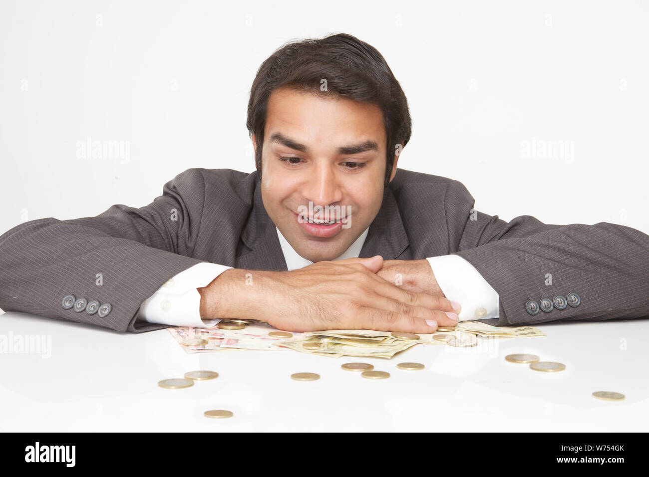 Businessman grabbing money Stock Photo - Alamy