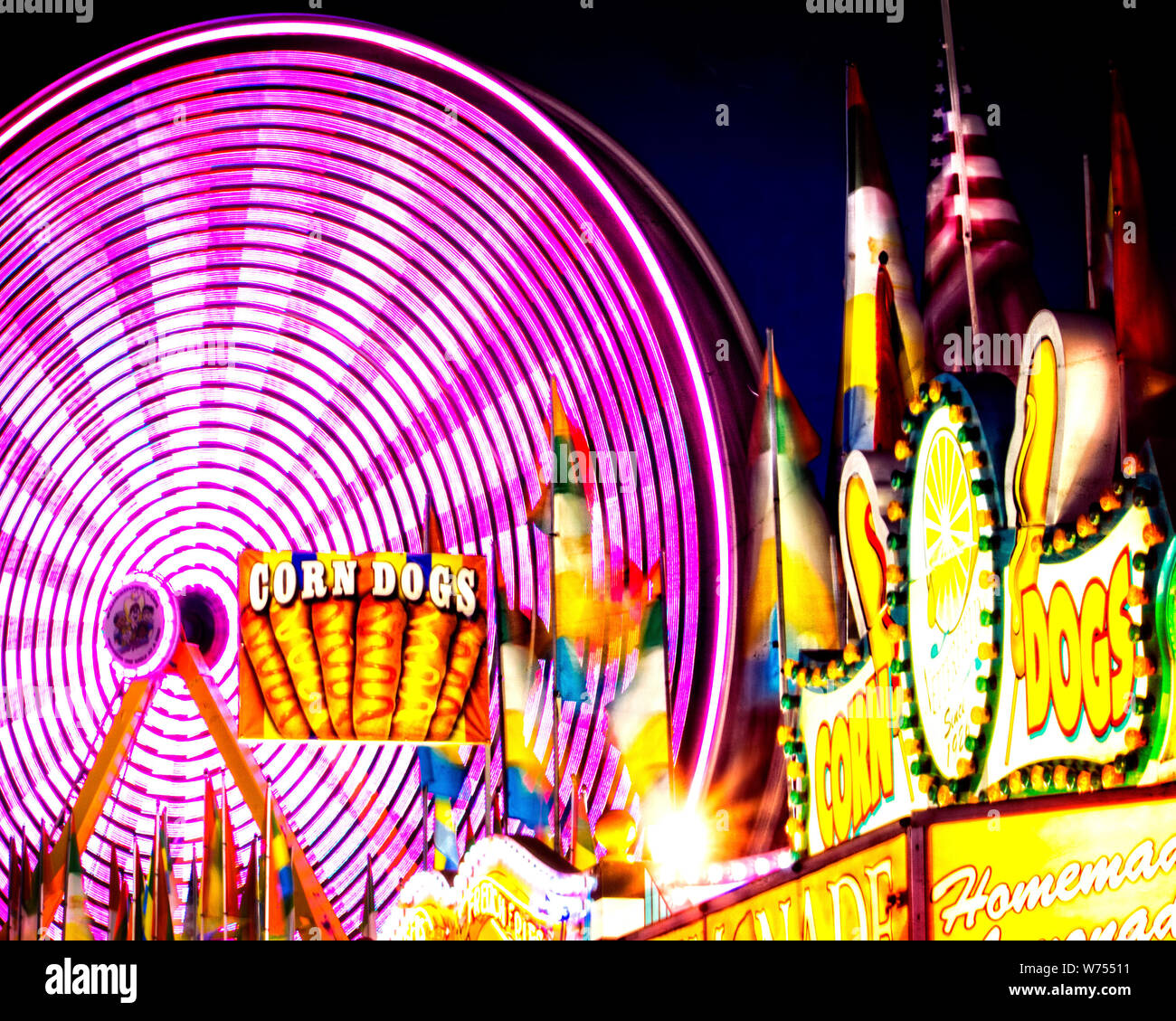 A spinning ferris wheel with changing colors is the centerpiece of the ...