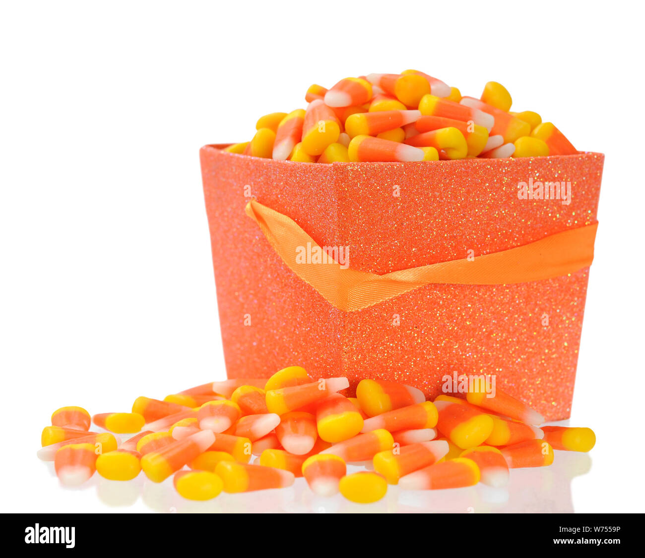 corn candy falling out busked isolated on white Stock Photo - Alamy