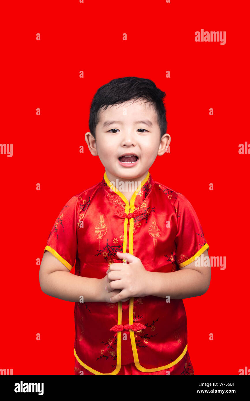 Chinese New Year Concept, Cute Asian boy in red traditional Chinese ...