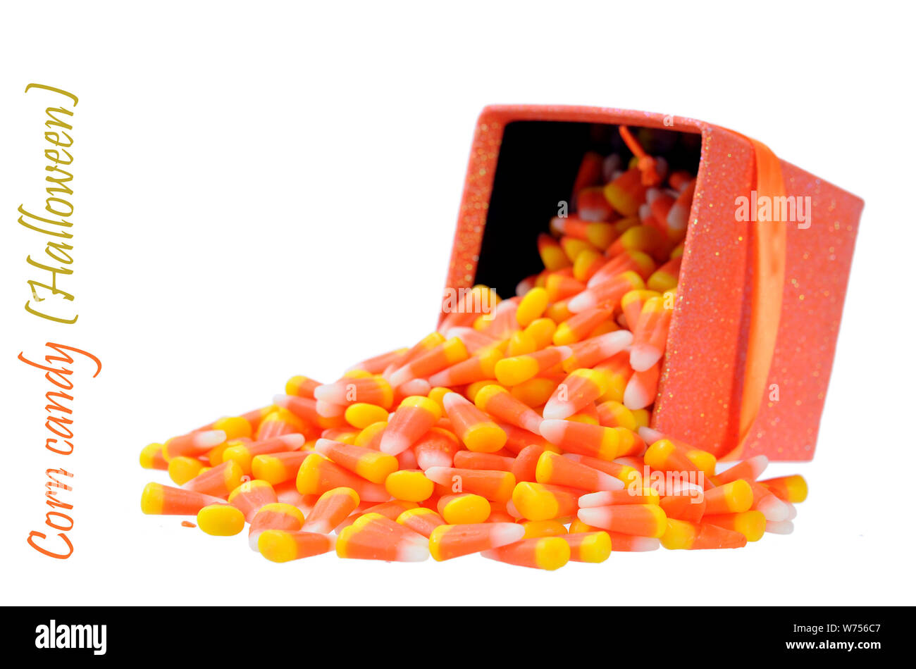 corn candy falling out busket isolated on white Stock Photo - Alamy