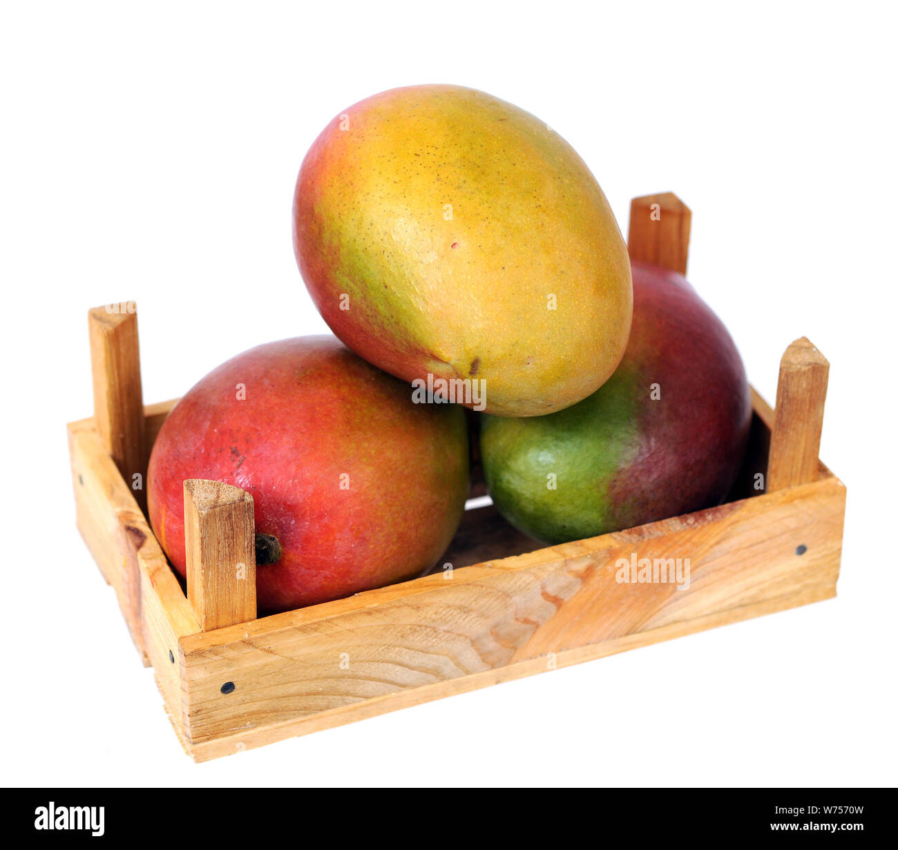 delicious Mexican mango in wooden crate isolated on white Stock Photo ...