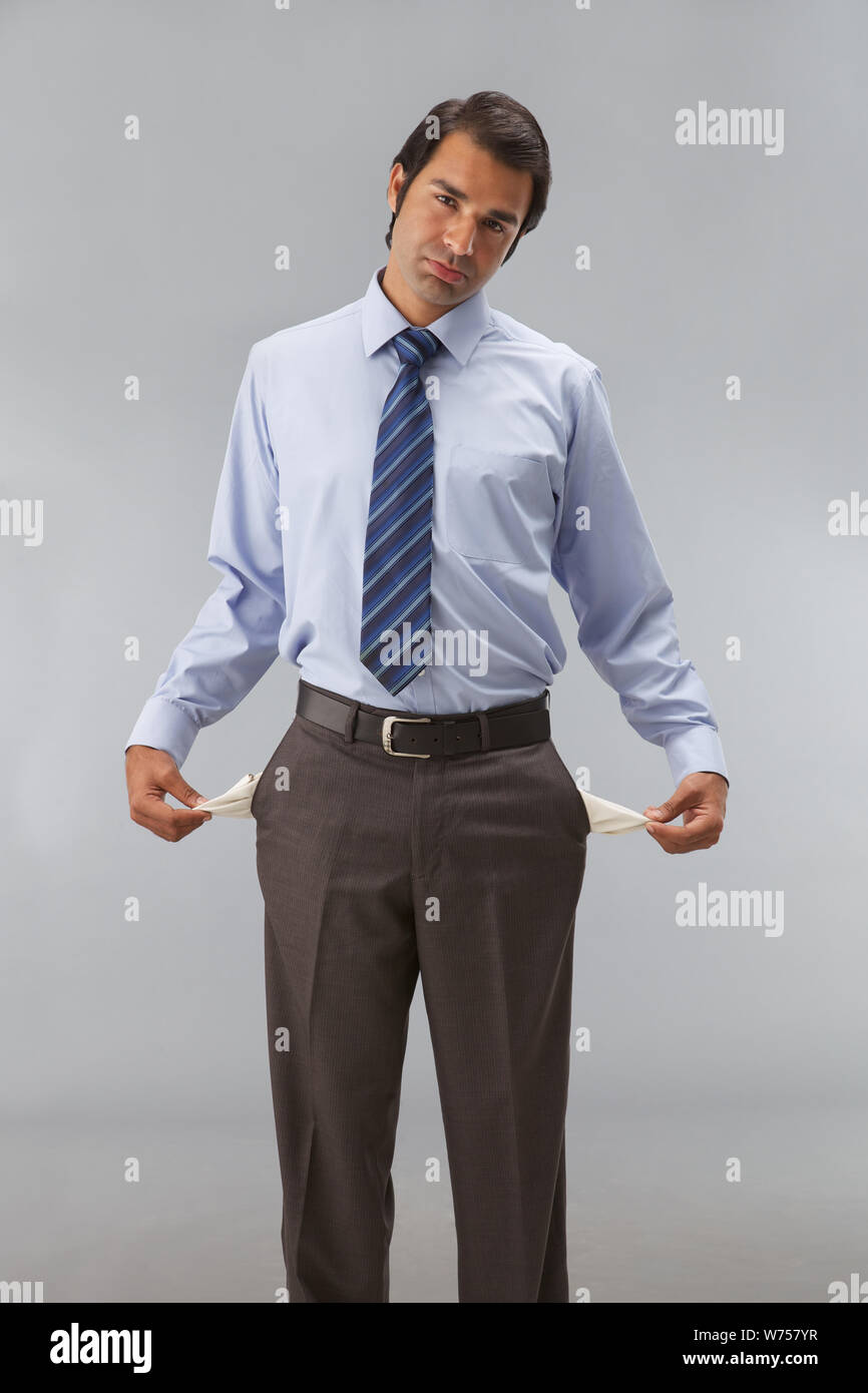 Indian man showing empty pockets hi-res stock photography and images ...