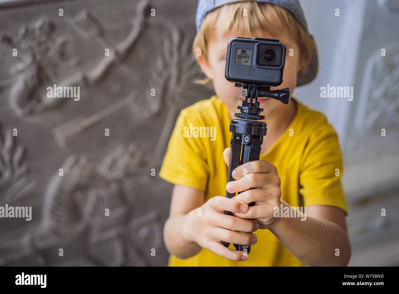 Little boy shoots a video on an action camera Stock Photo - Alamy