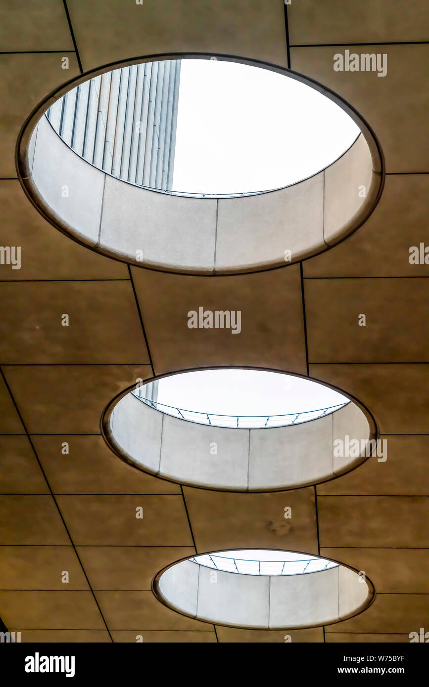 Close up of round skylights in a row viewed from inside a building ...