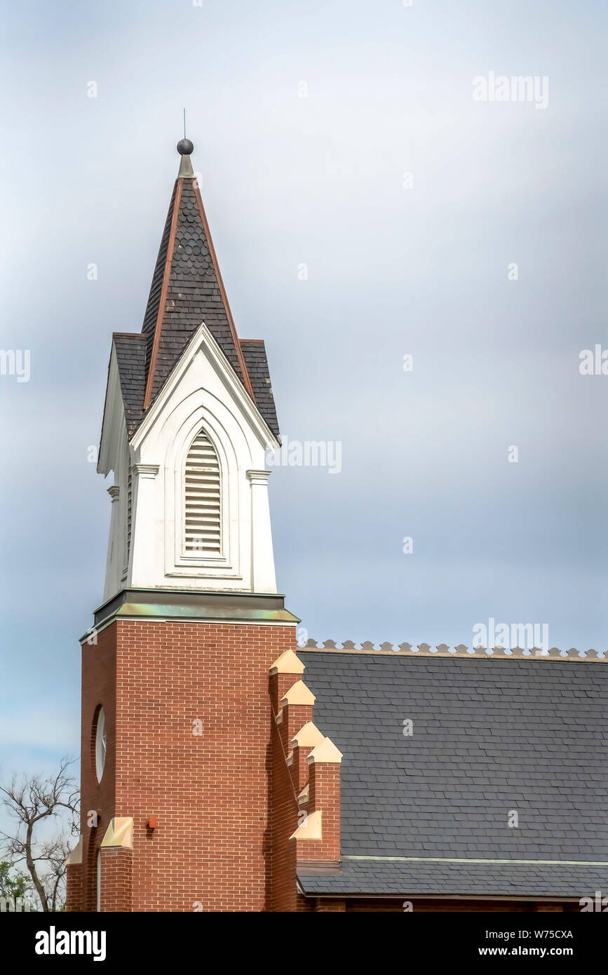 Side view of a church exterior with cloudy sky background on a sunny ...