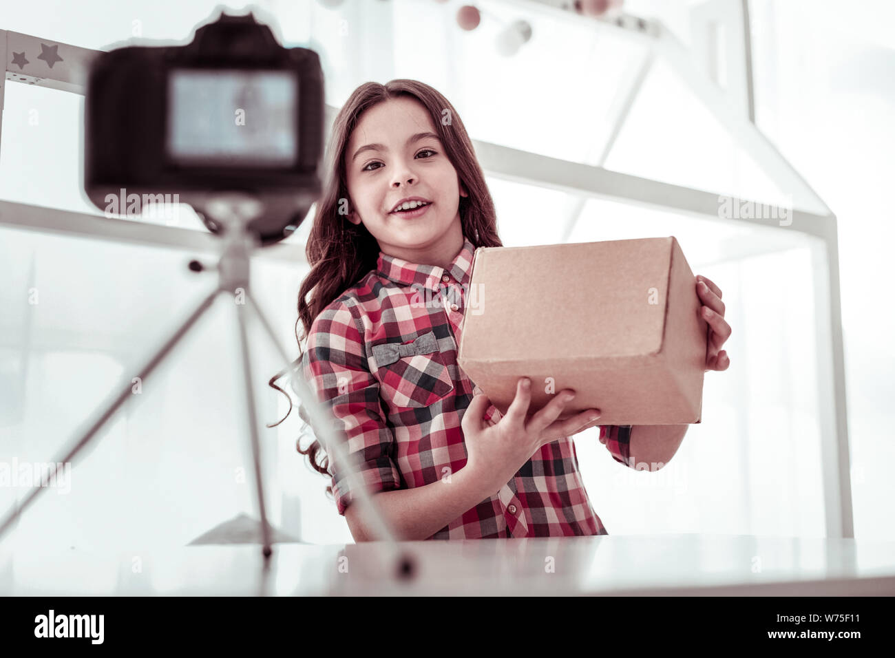 Positive happy girl standing in front of the camera Stock Photo - Alamy