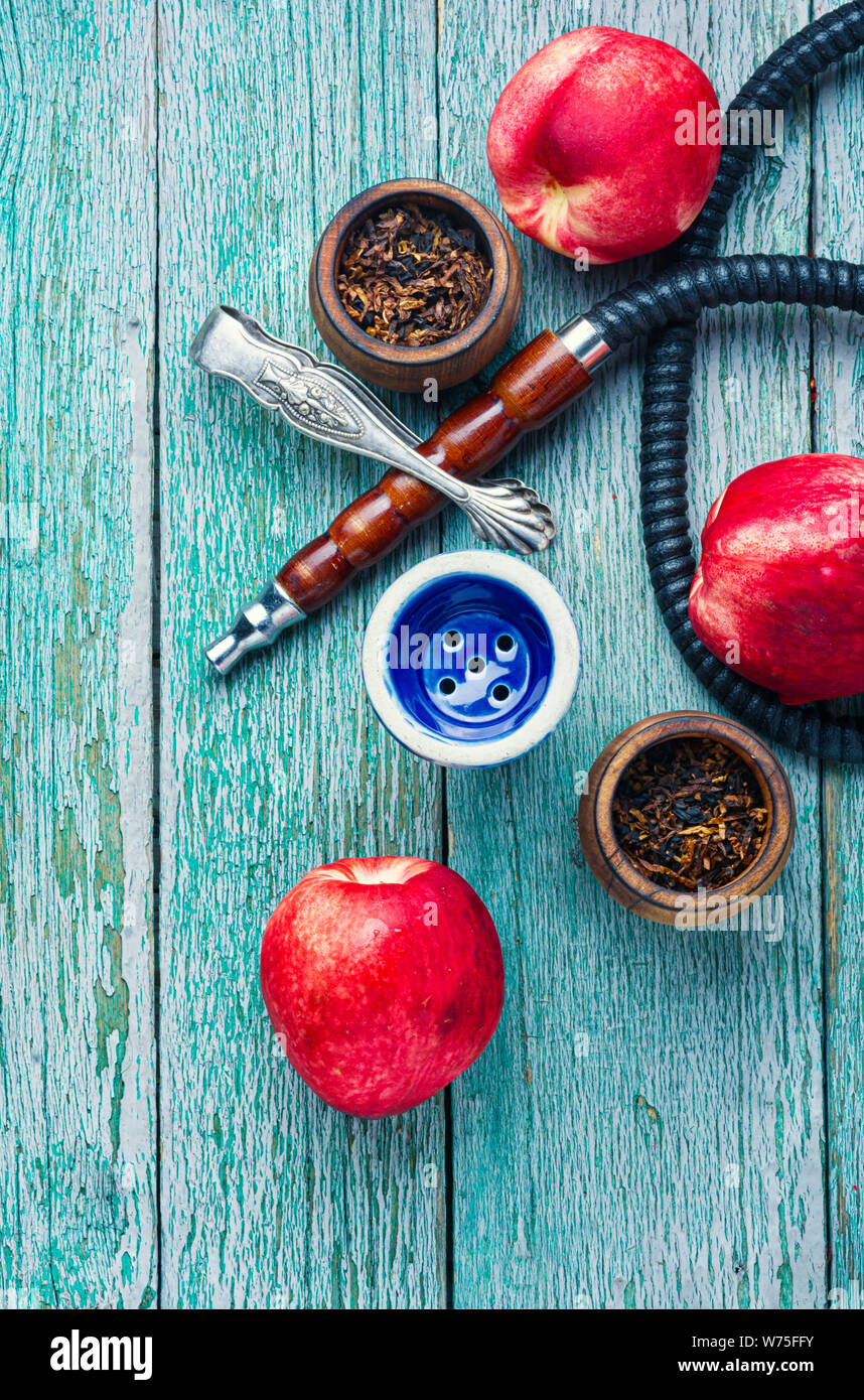 Tobacco shisha with nectarine flavor.Hookah with peach.Mouthpiece of ...